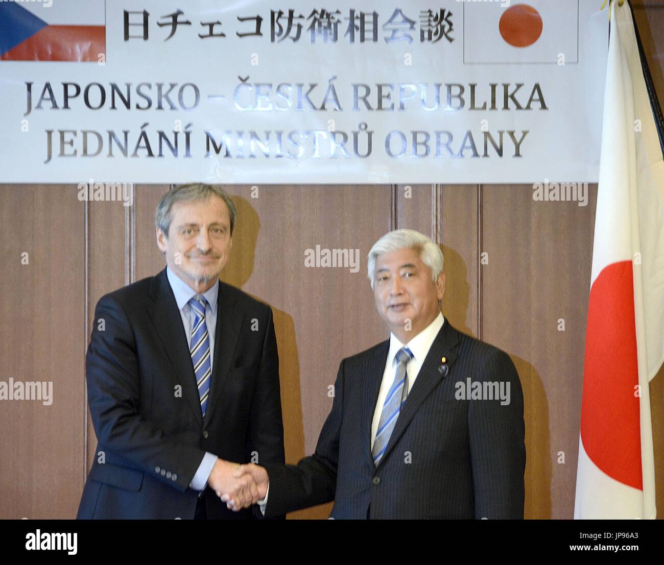 Japanese Defense Minister Gen Nakatani (R) shakes hands with his Czech ...