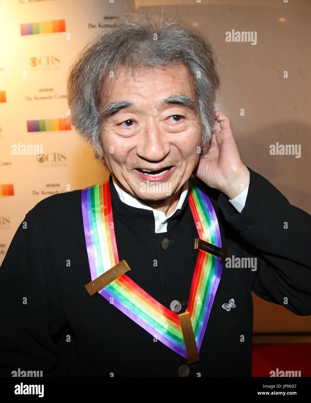 Japanese conductor Seiji Ozawa speaks to the press after receiving the ...