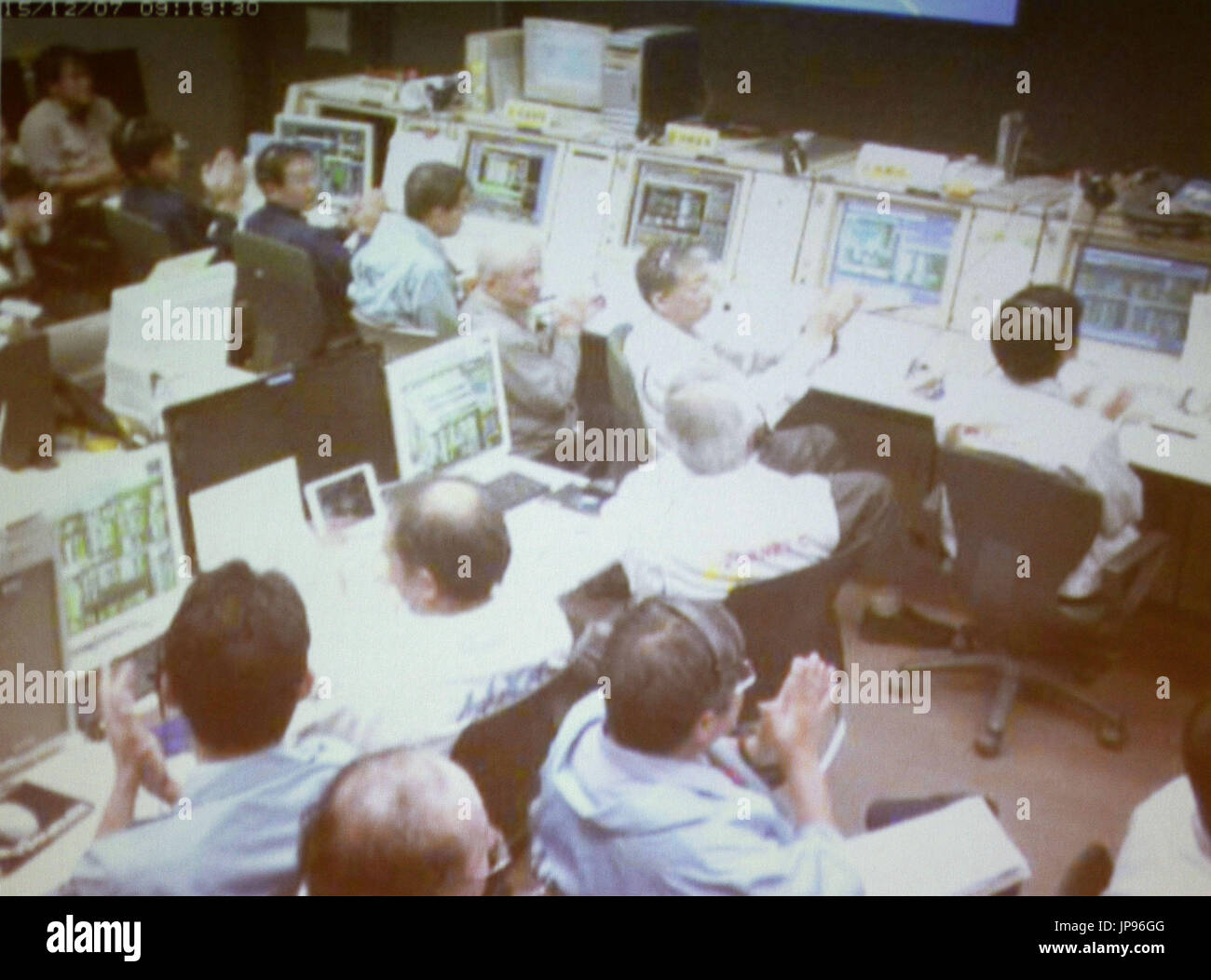Monitor image shows those working in the control room of the Japan ...