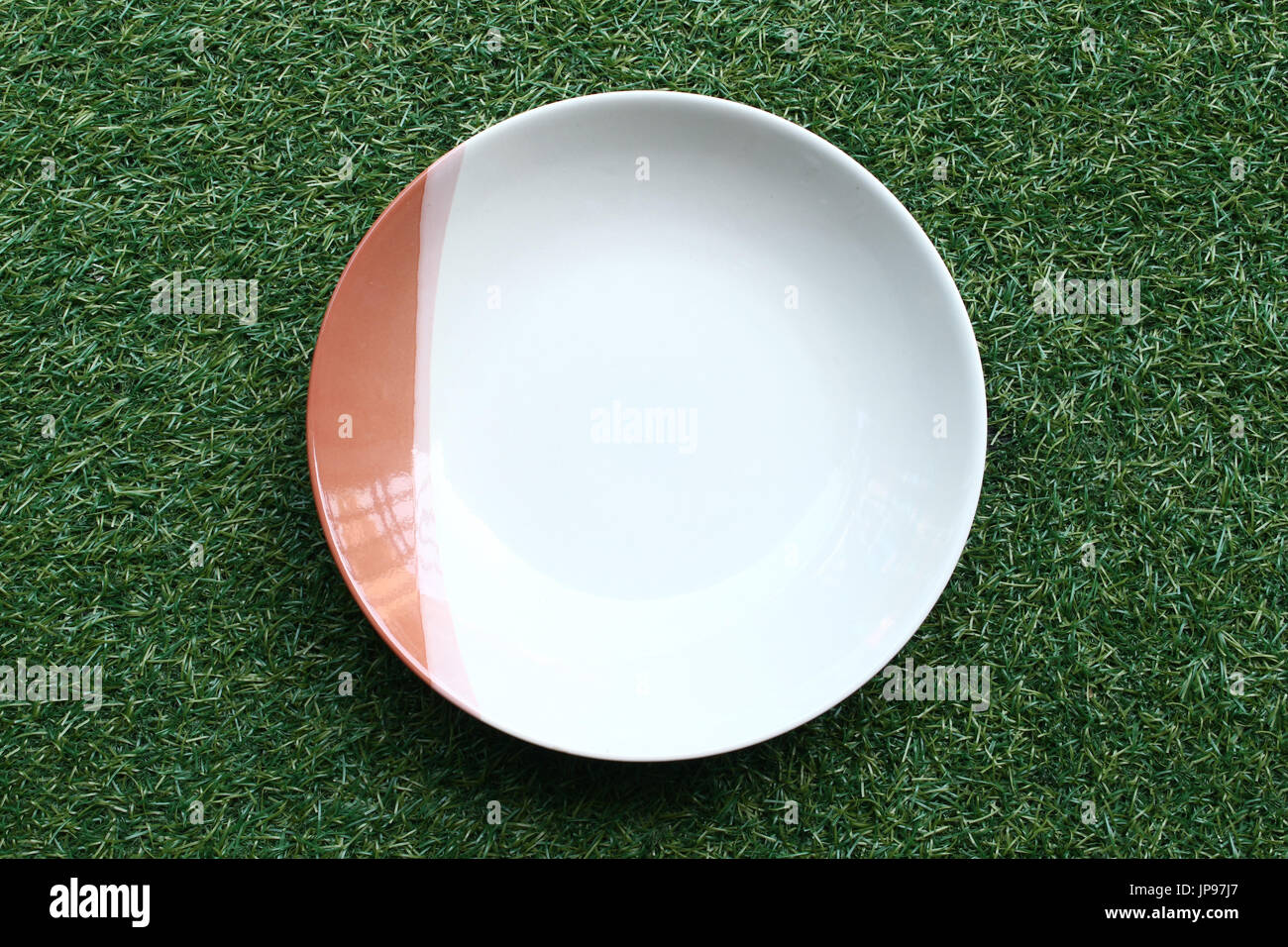 plate on grass Stock Photo - Alamy