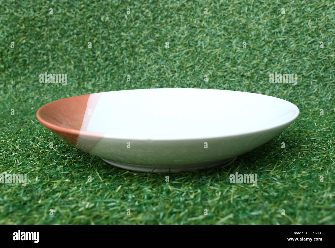 plate on grass Stock Photo - Alamy