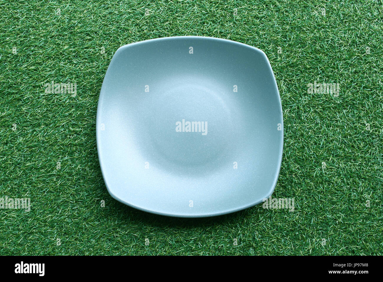 plate on grass Stock Photo - Alamy