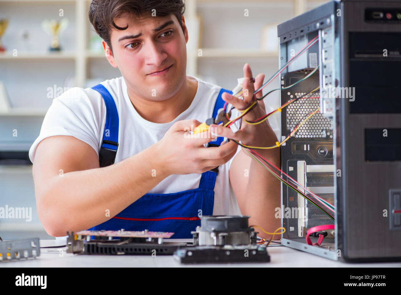 Computer repairman repairing desktop computer Stock Photo - Alamy