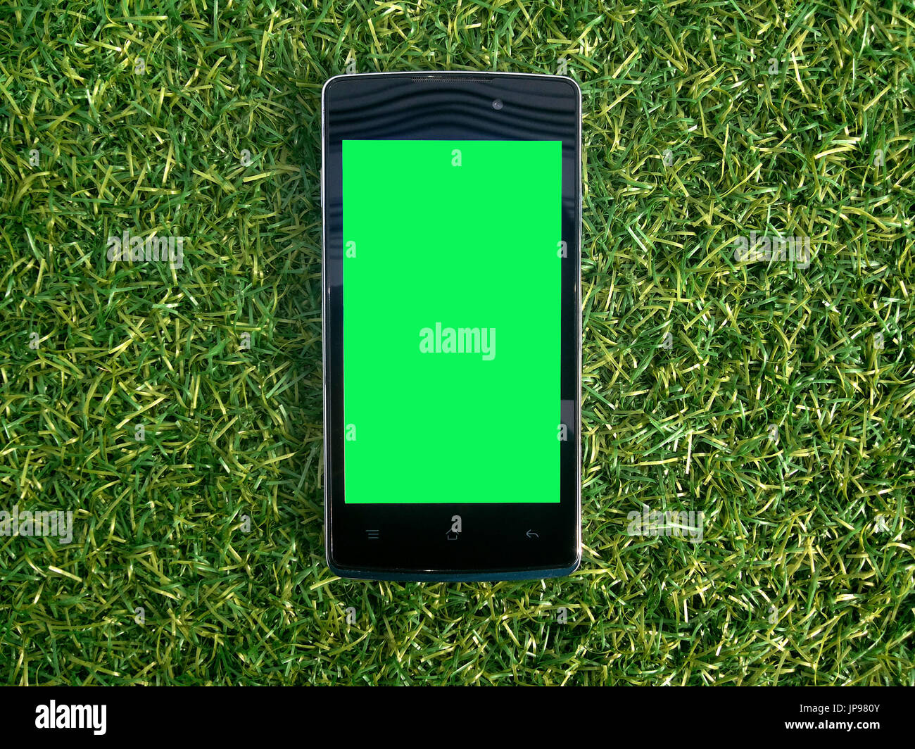 mobile phone on grass Stock Photo - Alamy
