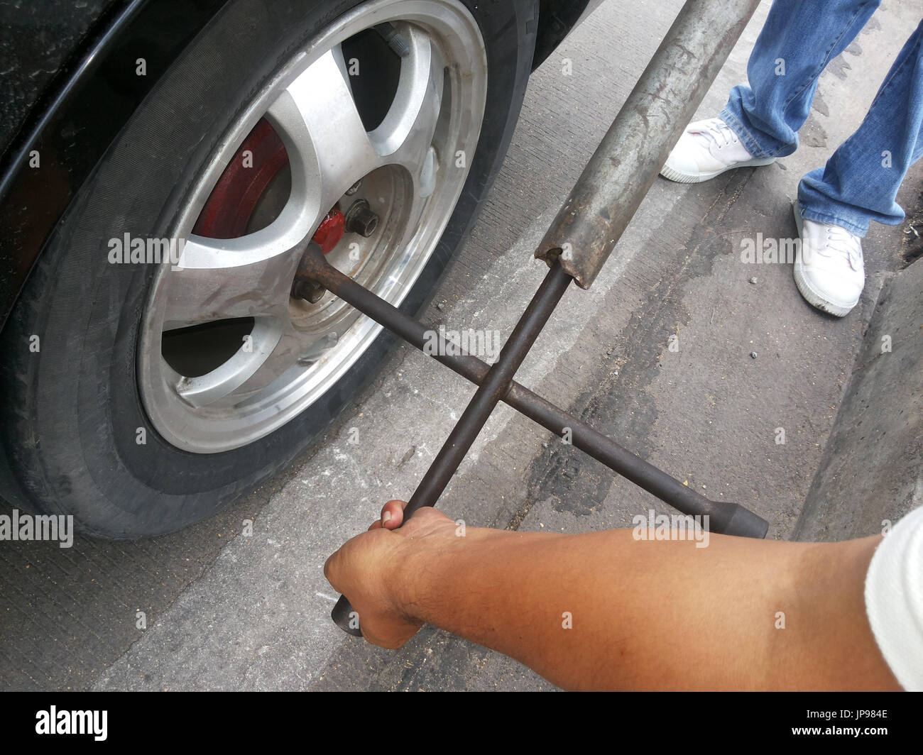 changing a tire on road Stock Photo - Alamy