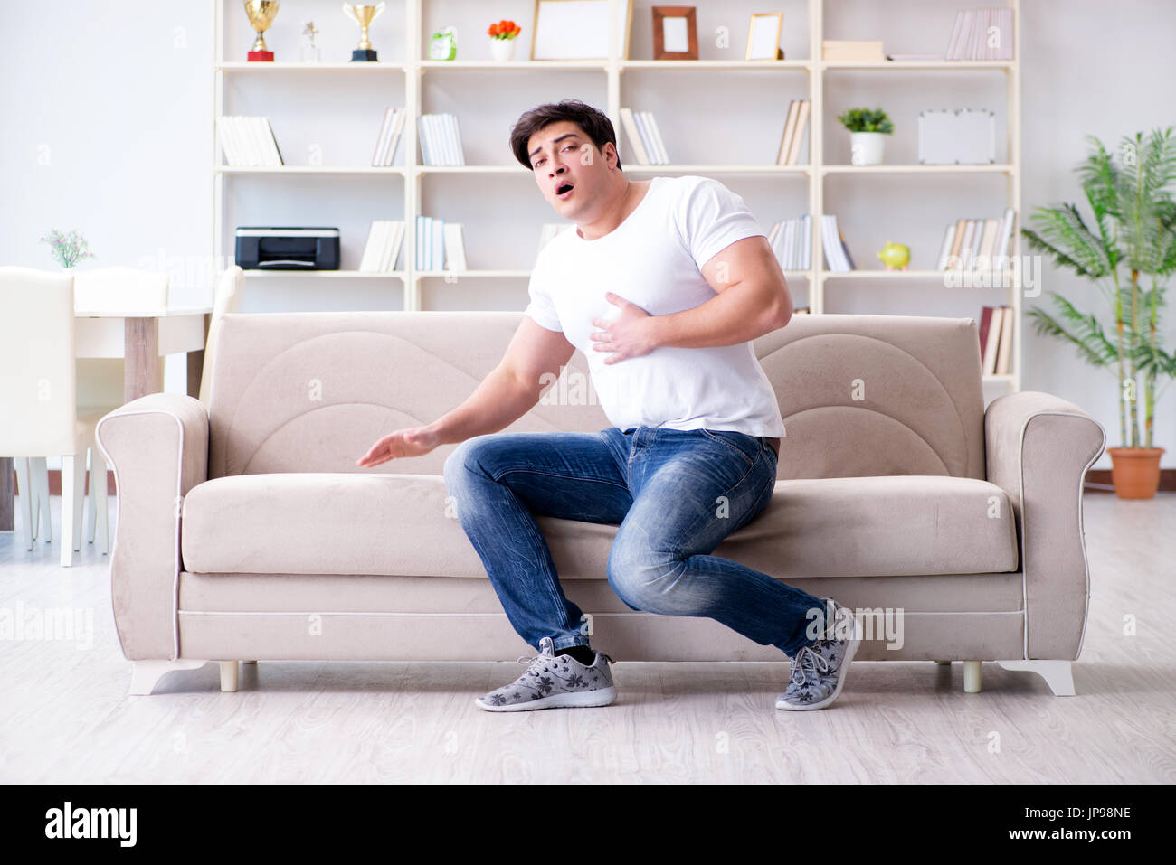 Man suffering from sick stomach and vomiting Stock Photo - Alamy