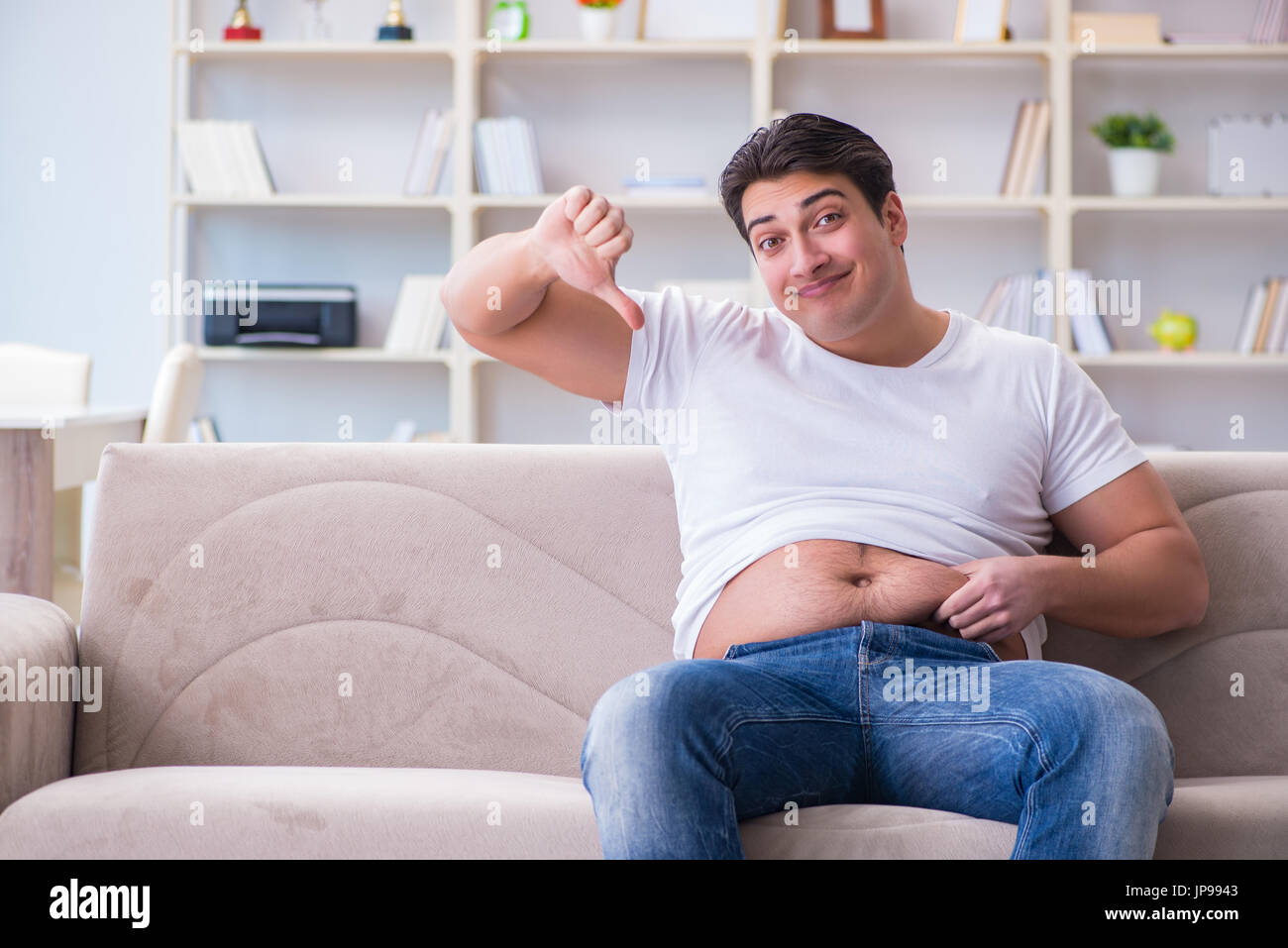 Man suffering from extra weight in diet concept Stock Photo - Alamy
