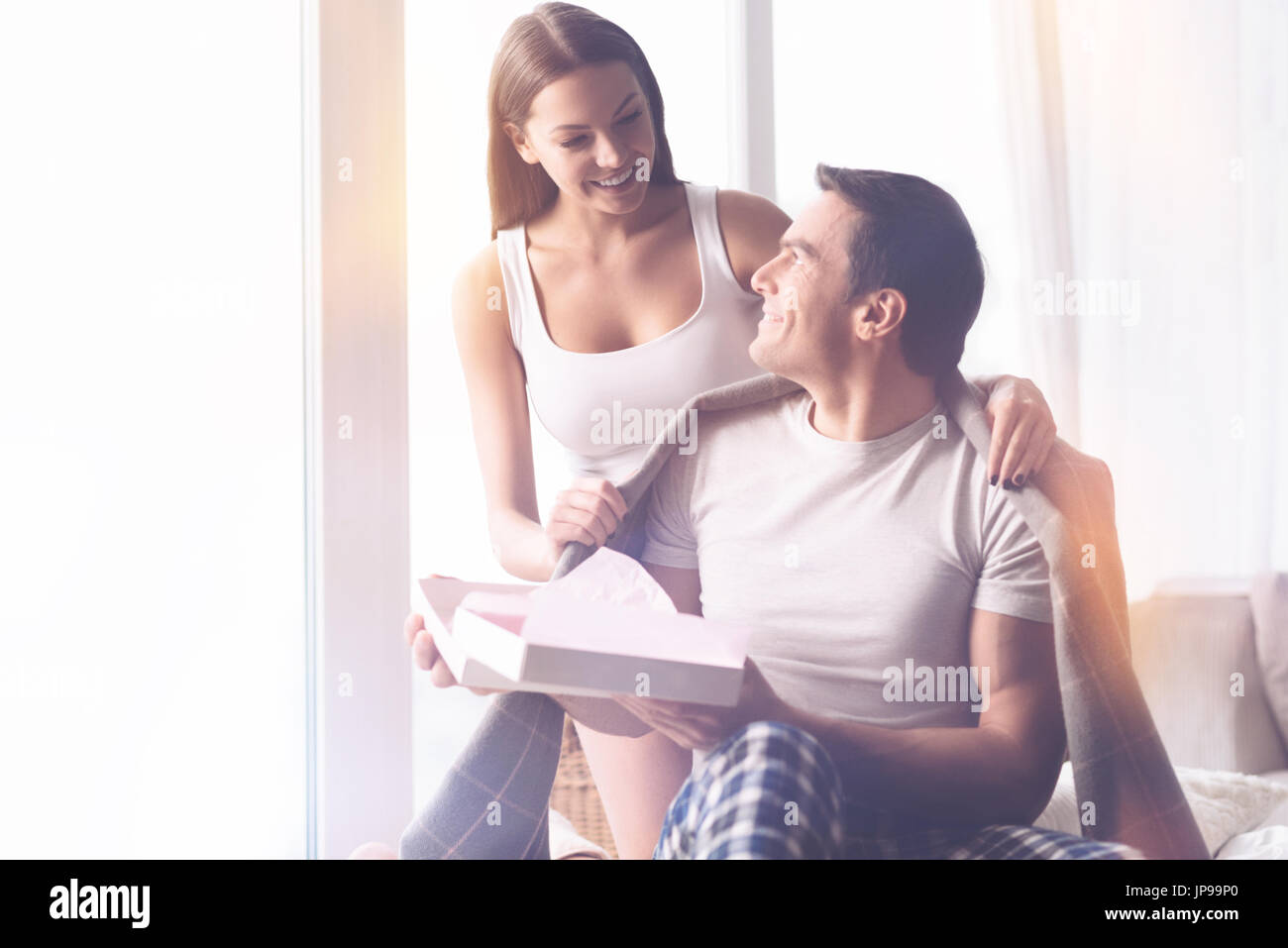 Smiling female putting her hands on the shoulder of boyfriend Stock ...