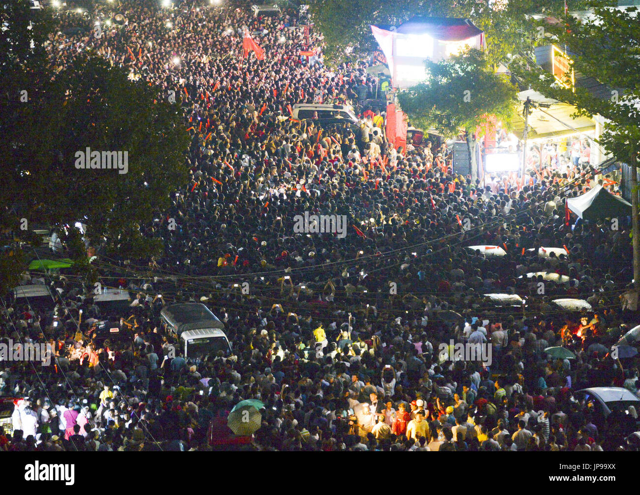 A huge crowd of supporters gather in front of the headquarters of the ...