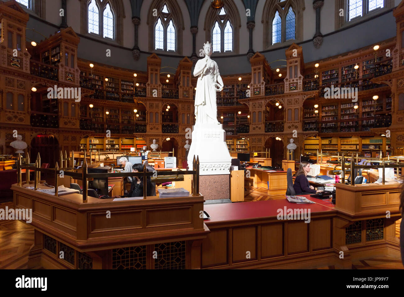 The main reading room of the Library of Parliament with a white marble ...