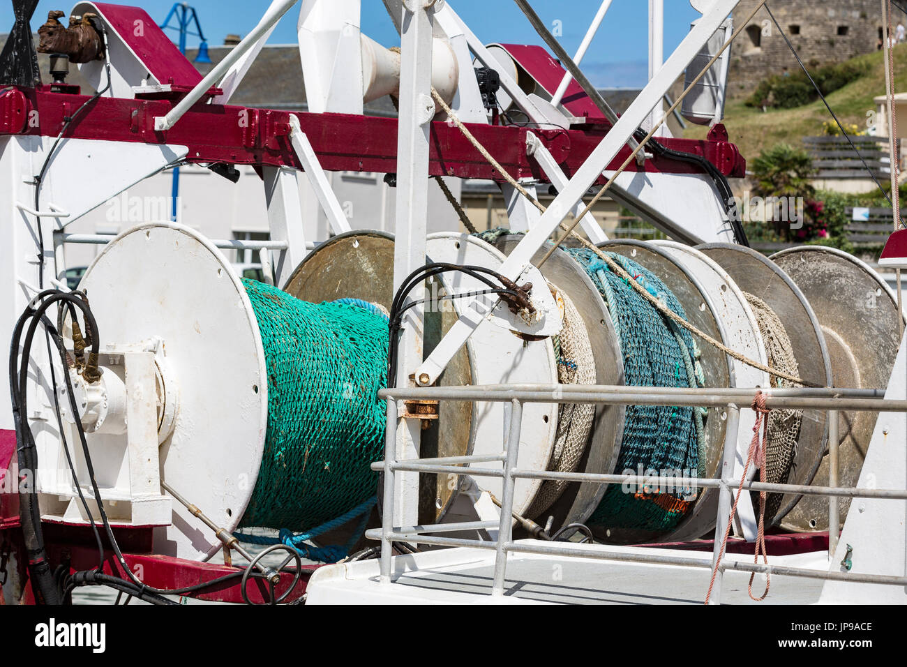 Fishing colored net on boat industrial fish Stock Photo - Alamy