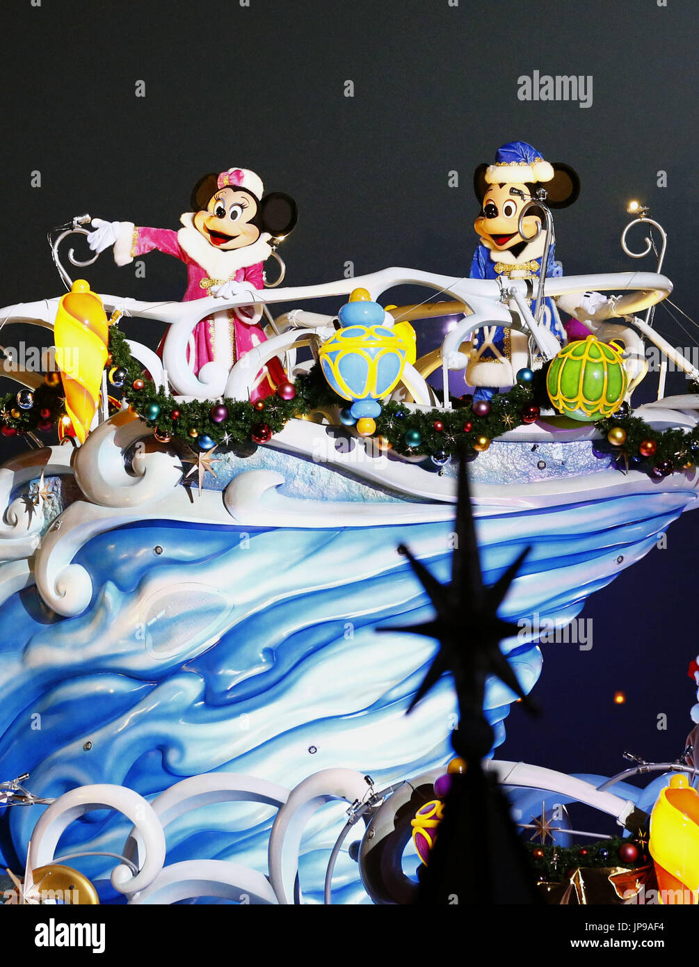 Mickey Mouse and Minnie Mouse appear on a float during an illuminated ...