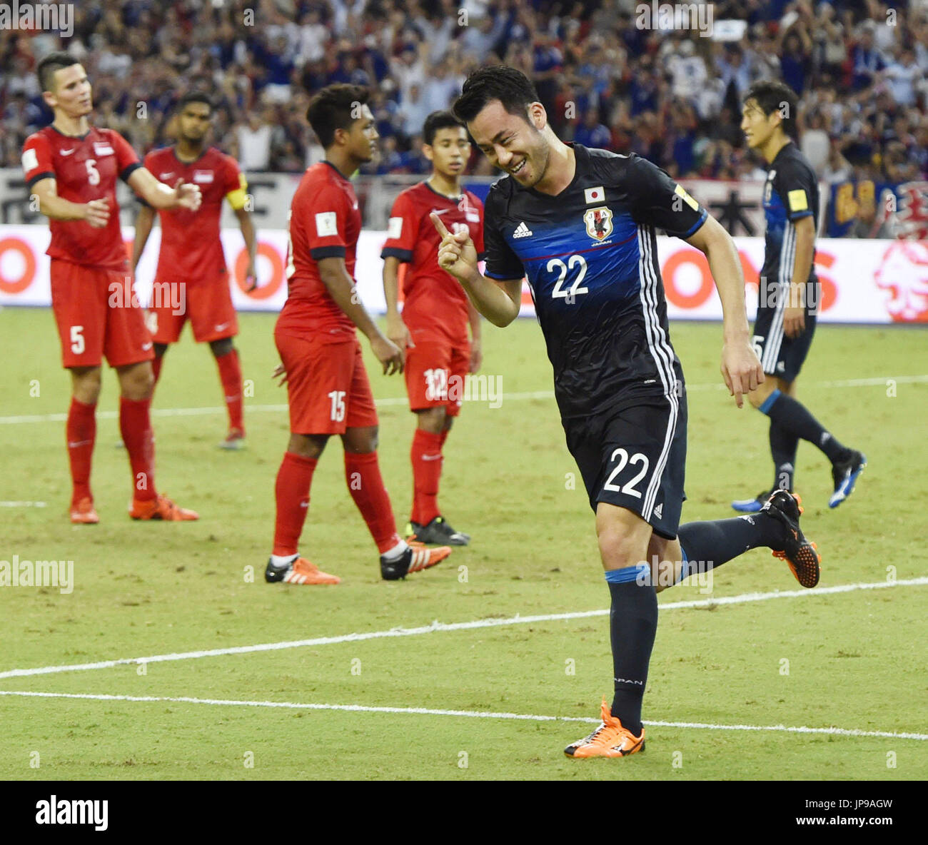 Japan's Maya Yoshida celebrates after scoring his side's third goal ...
