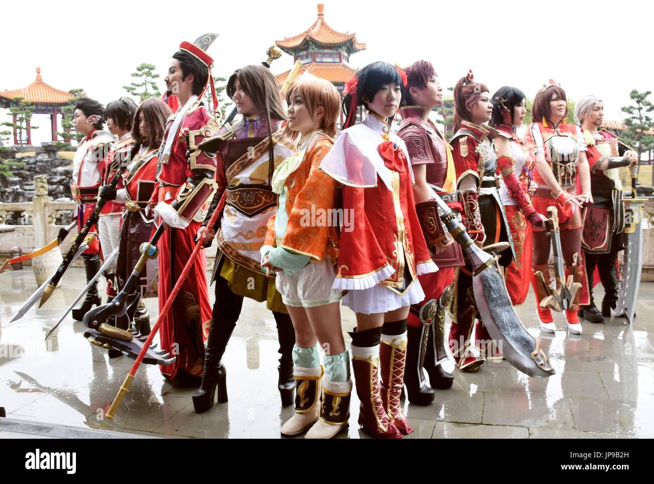 Cosplayers in various costumes of characters from comic books ...