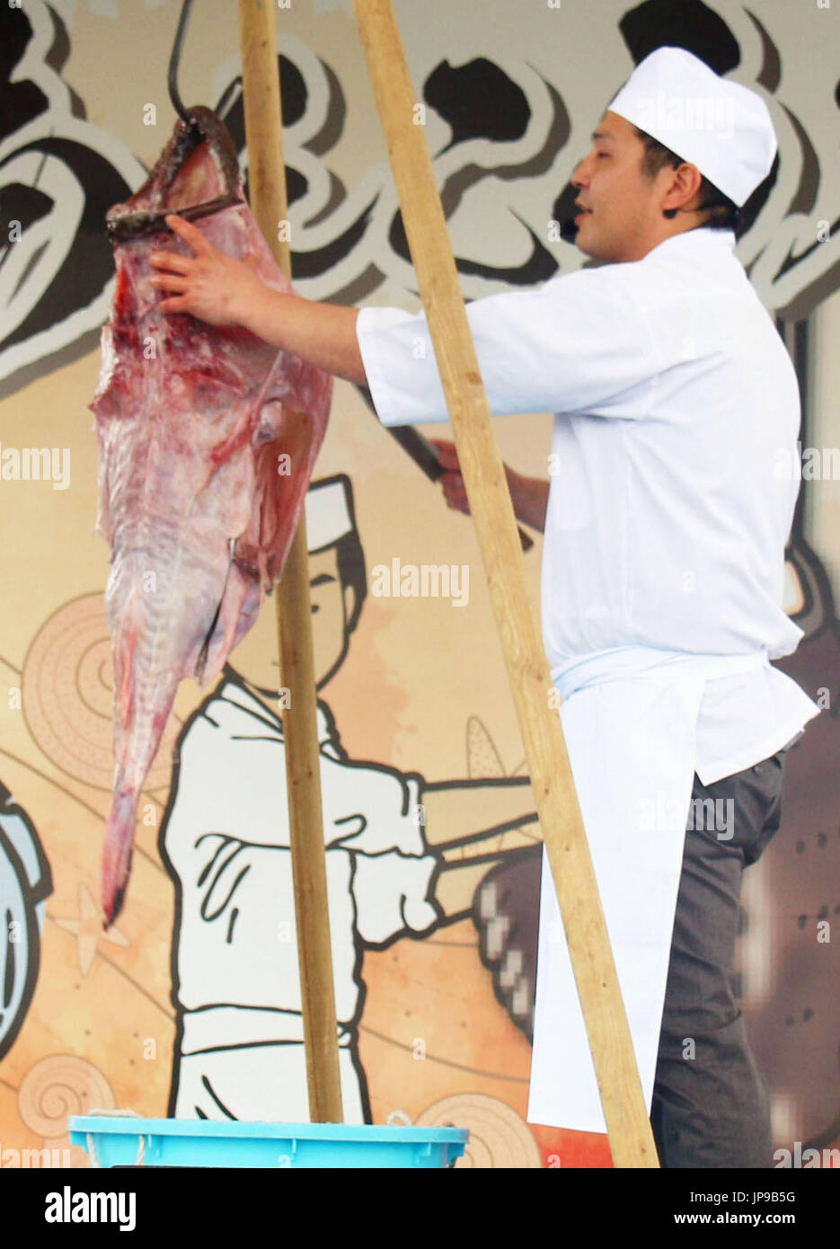 A chef demonstrates how to fillet an "anko" angler fish during a ...