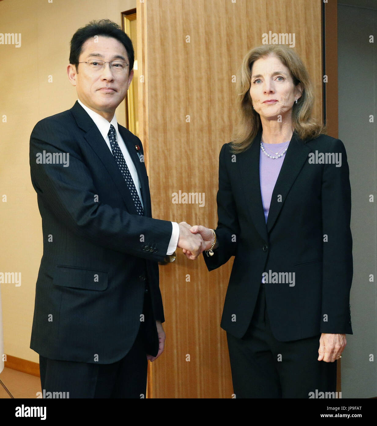 Japanese Foreign Minister Fumio Kishida (L) and U.S. Ambassador to ...