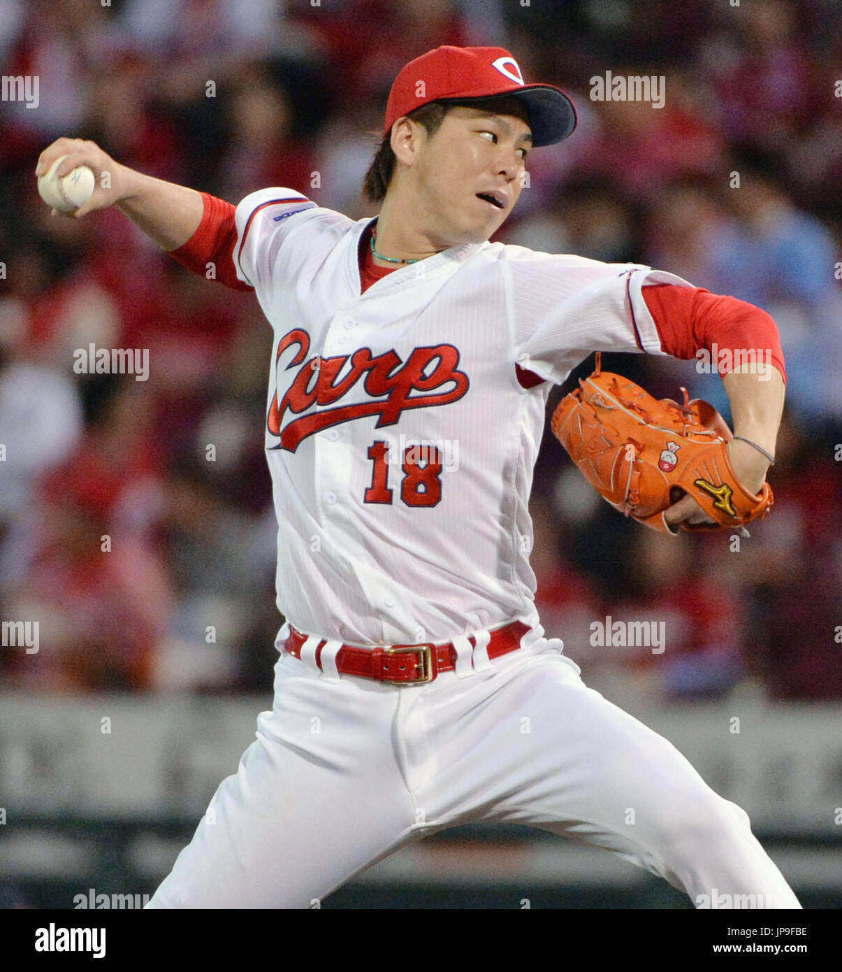 Undated file photo shows Hiroshima Carp ace Kenta Maeda pitching. The Los Angeles Dodgers have ...