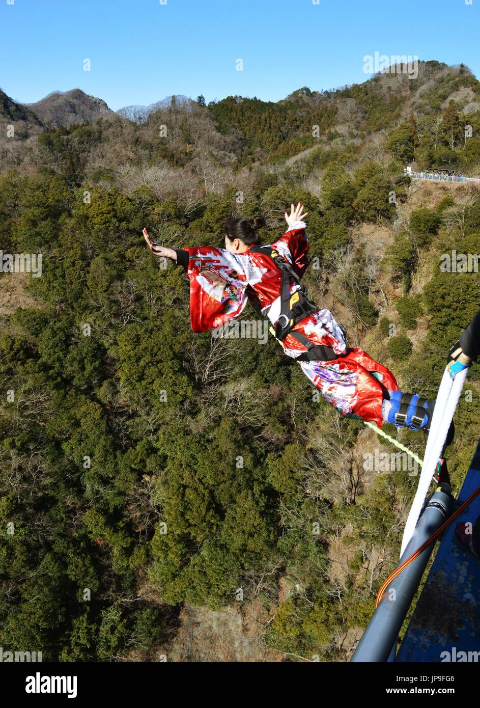 A woman bungee-jumps in kimono from Ryujin Otsuribashi bridge in the ...