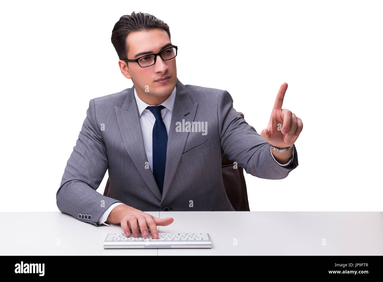 Young businessman typing on a keyboard pressing virtual buttons ...