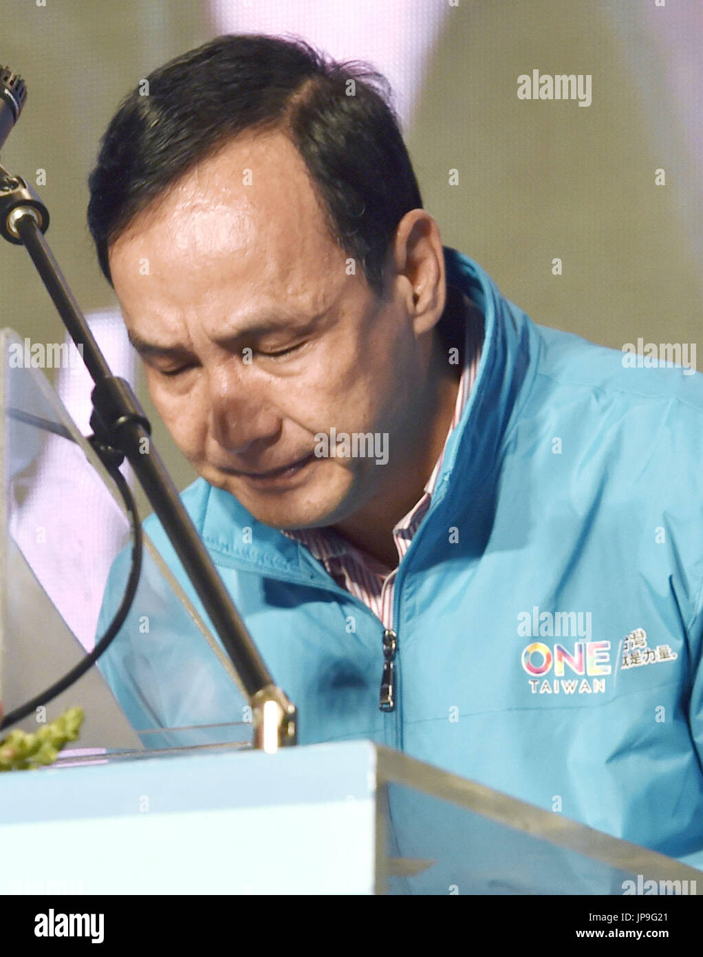 Taiwan's ruling Nationalist Party (KMT) chairman Eric Chu bows in front ...
