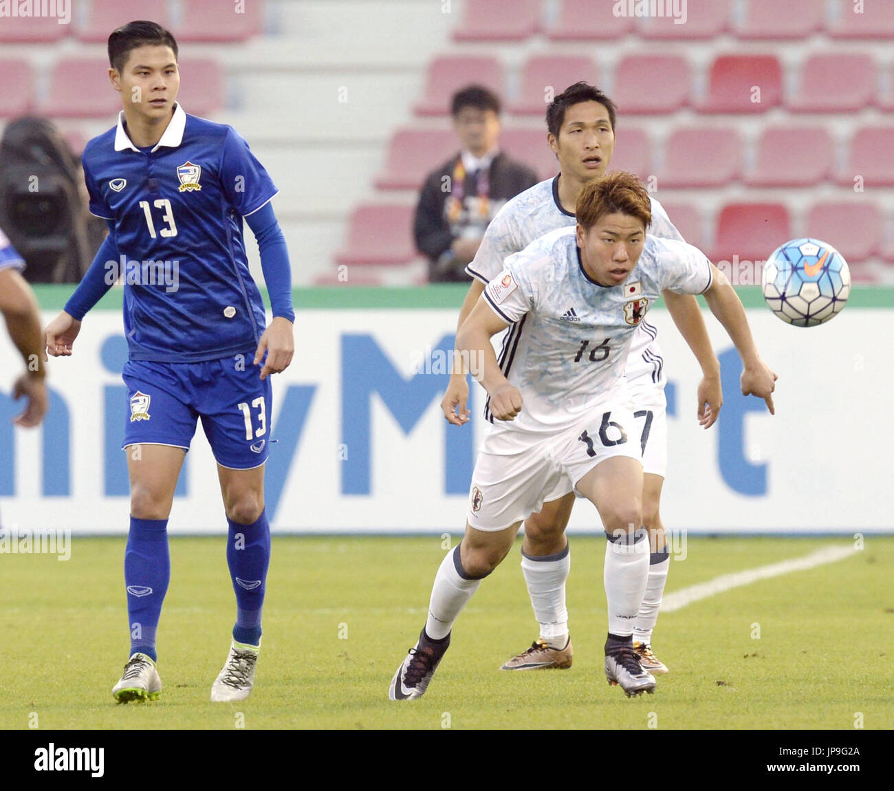 Takuma Asano (16) of Japan's Under-23 team rushes forward with the ball ...