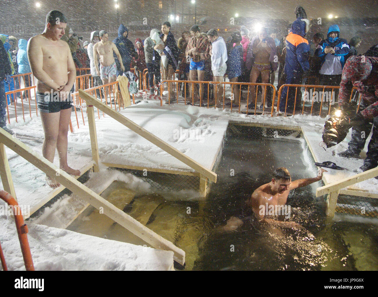 Russian Orthodox Church members mark the festival of Epiphany by ...