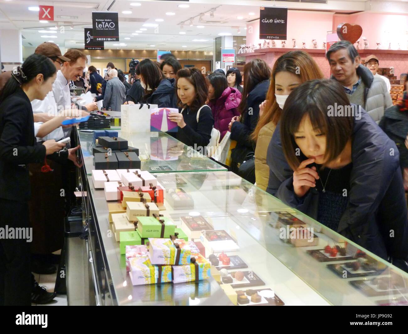 Shoppers crowd the Valentine's Day chocolate section of the JR Nagoya ...