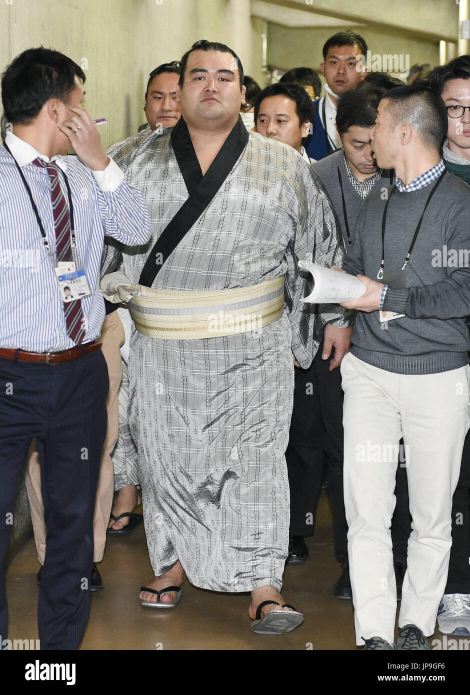 Kotoshogiku is surrounded by reporters after losing to Toyonoshima at ...
