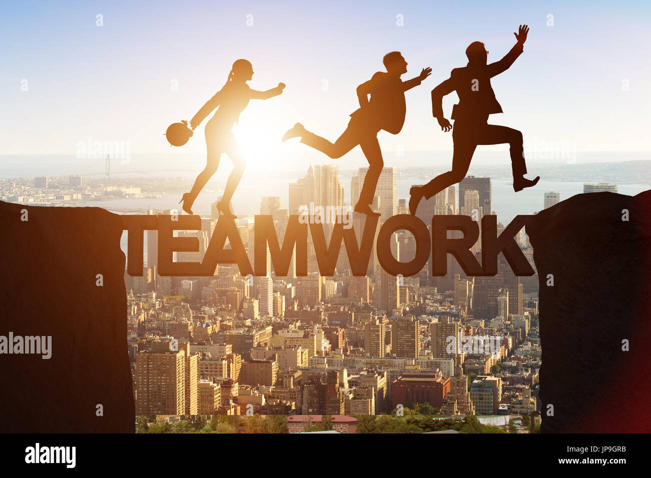 Teamwork concept with business people crossing bridge Stock Photo - Alamy