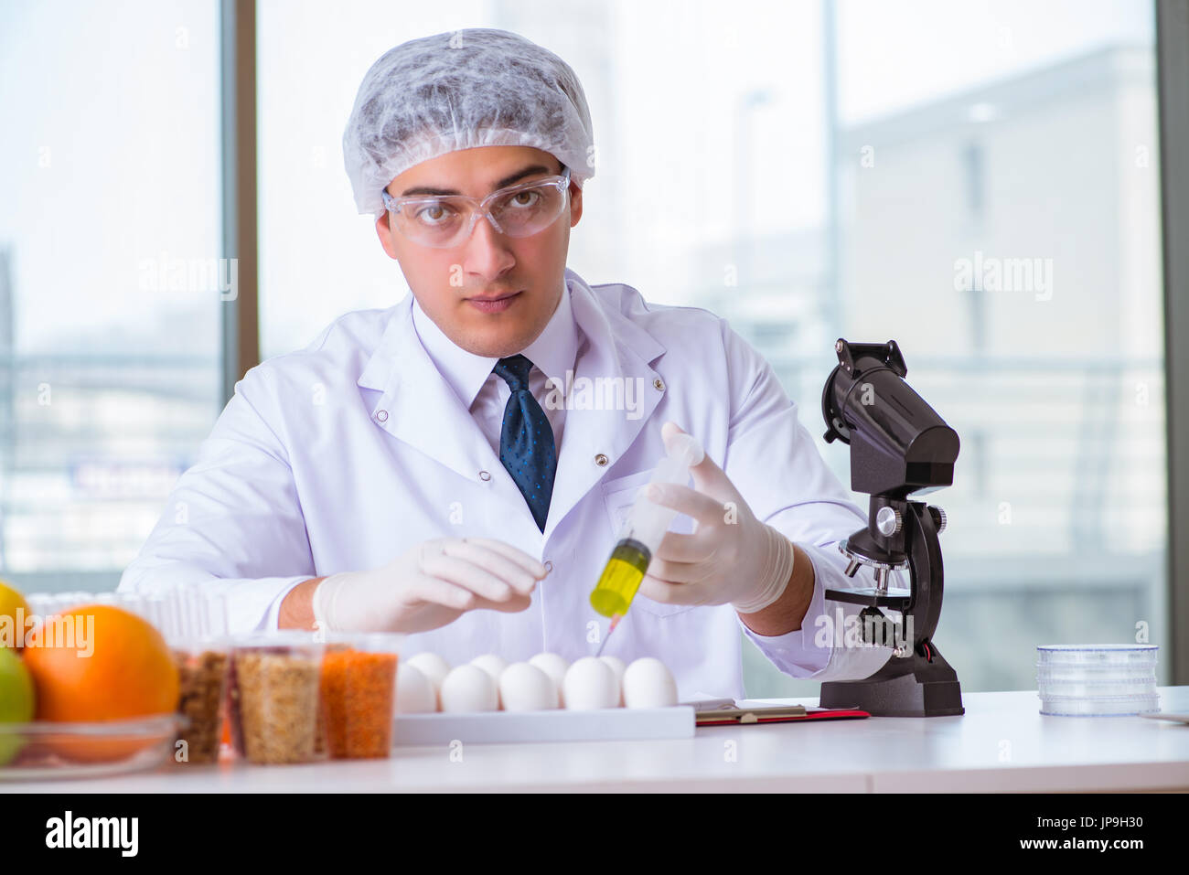 Nutrition expert testing food products in lab Stock Photo - Alamy