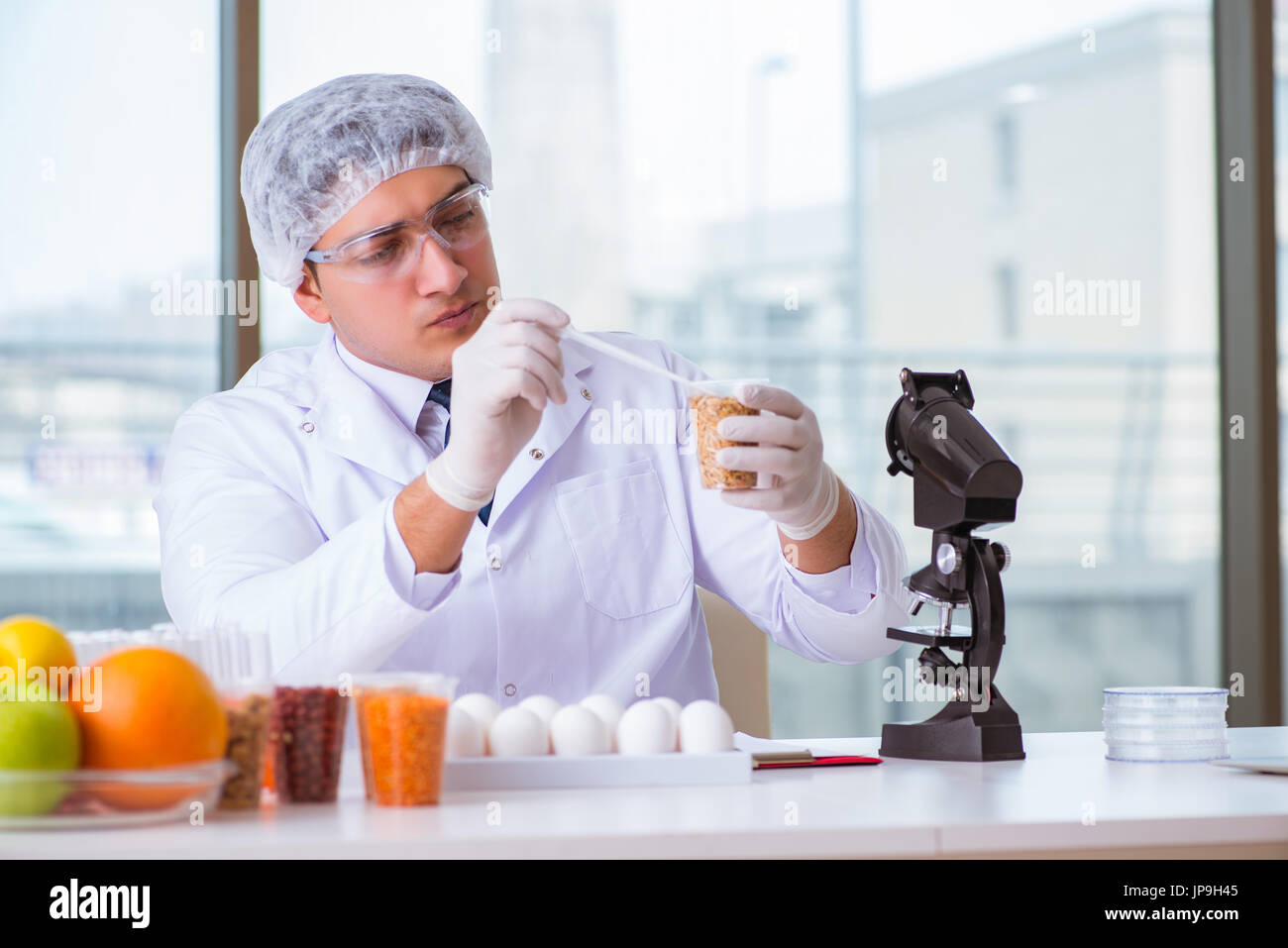 Nutrition expert testing food products in lab Stock Photo - Alamy