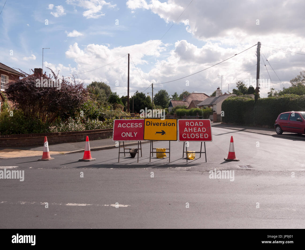 road works road blocked signs and traffic cones diversion access only ...