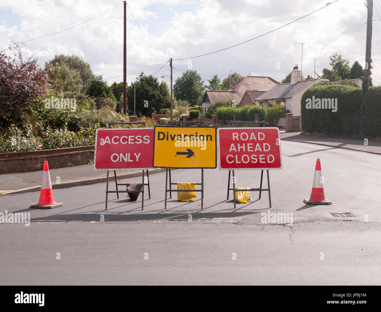 road works road blocked signs and traffic cones diversion access only ...