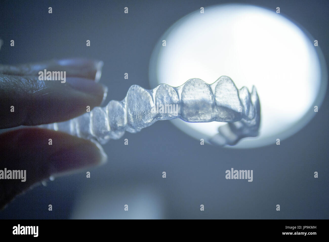 Transparent dental orthodontics with white light background Stock Photo ...