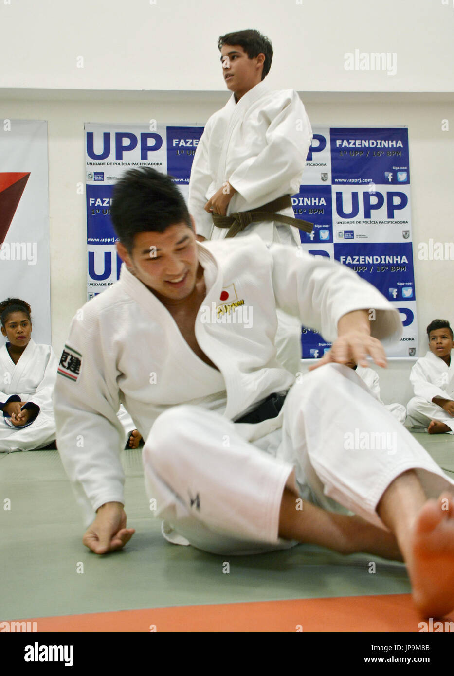 Olympic judo gold medalist Kosei Inoue gets thrown by a Brazilian child ...