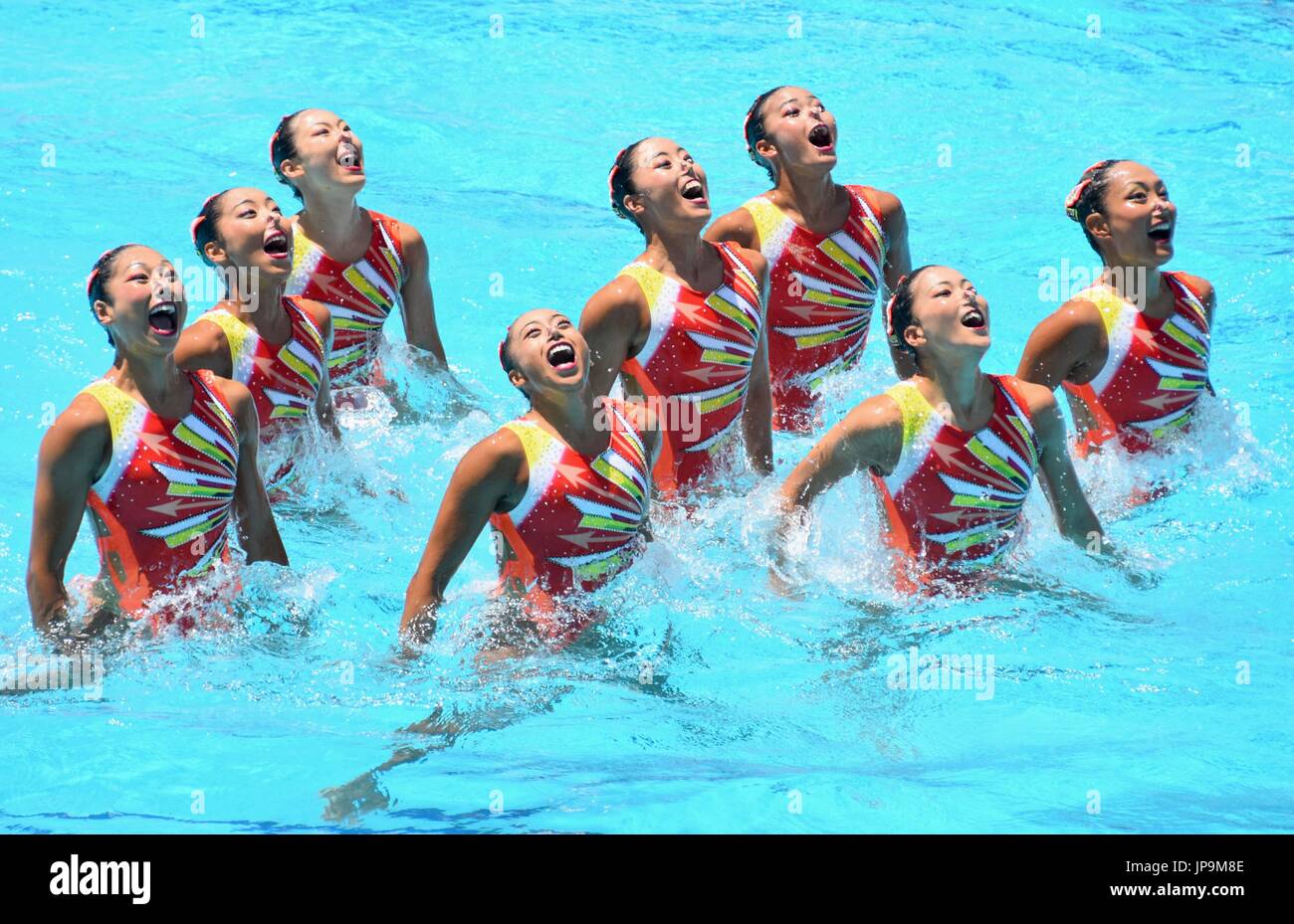 Japan's synchronized swimming team performs during the team's free ...