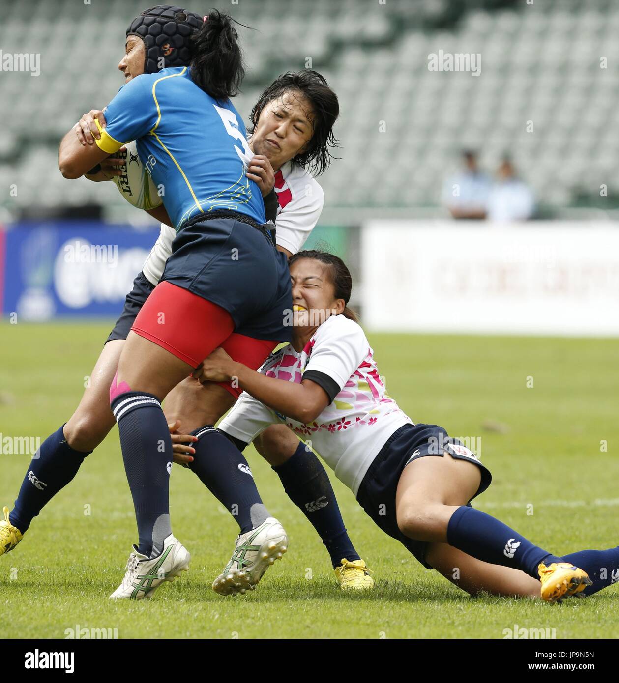 Japanese rugby players Marie Yamaguchi (R) and Chiharu Nakamura (C ...