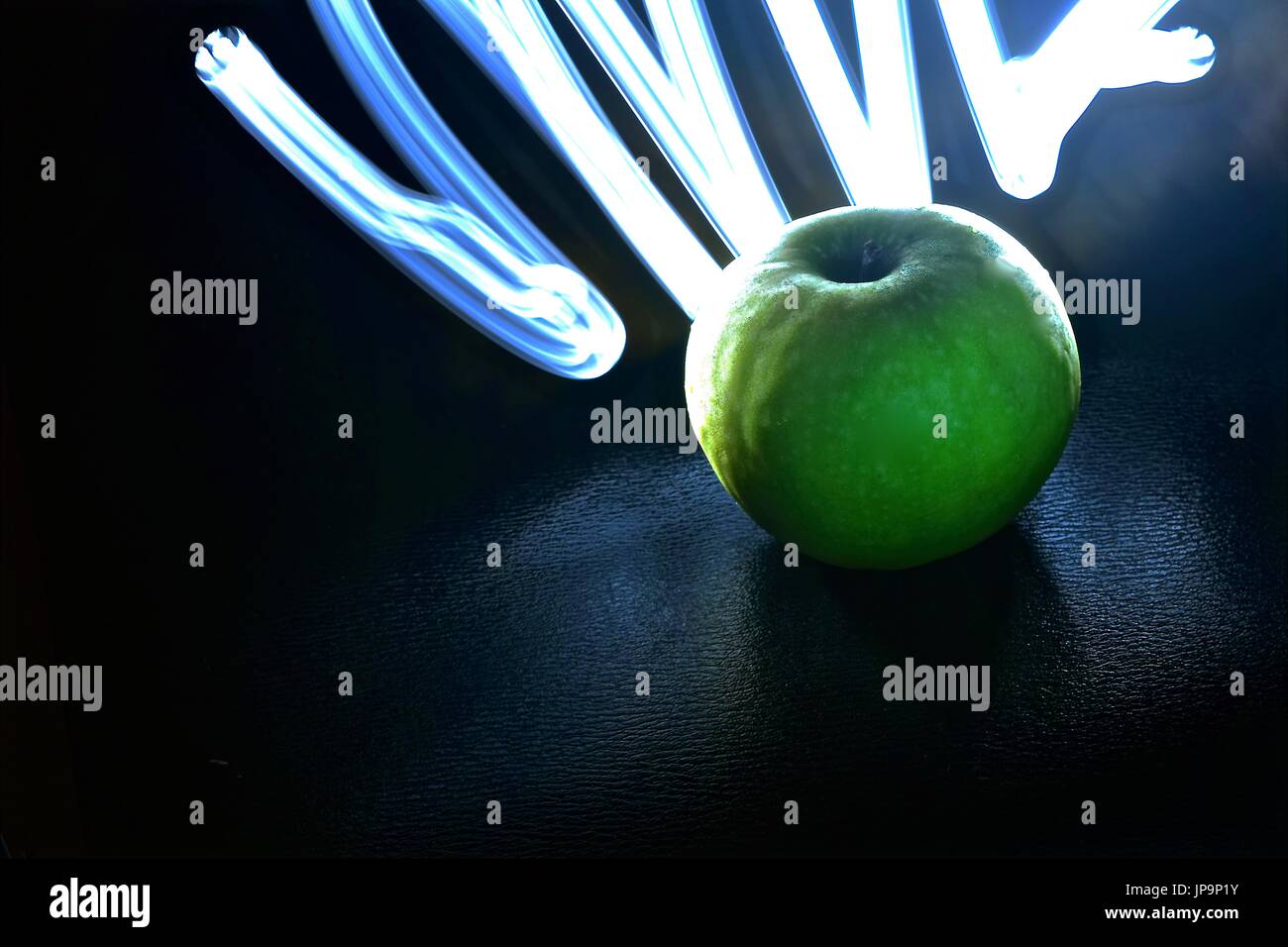 Green apple light painting using long exposure on camera Stock Photo ...