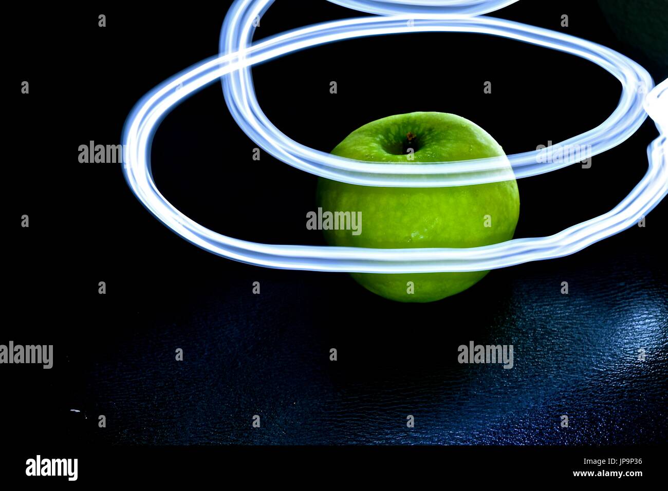 Green apple light painting using long exposure on camera Stock Photo ...