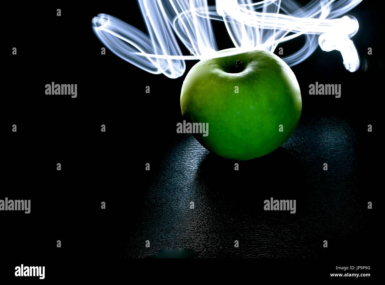 Green apple light painting using long exposure on camera Stock Photo ...