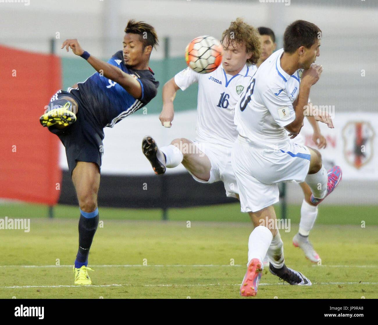 Striker Musashi Suzuki (far L) of Japan's U-22 national team takes a ...
