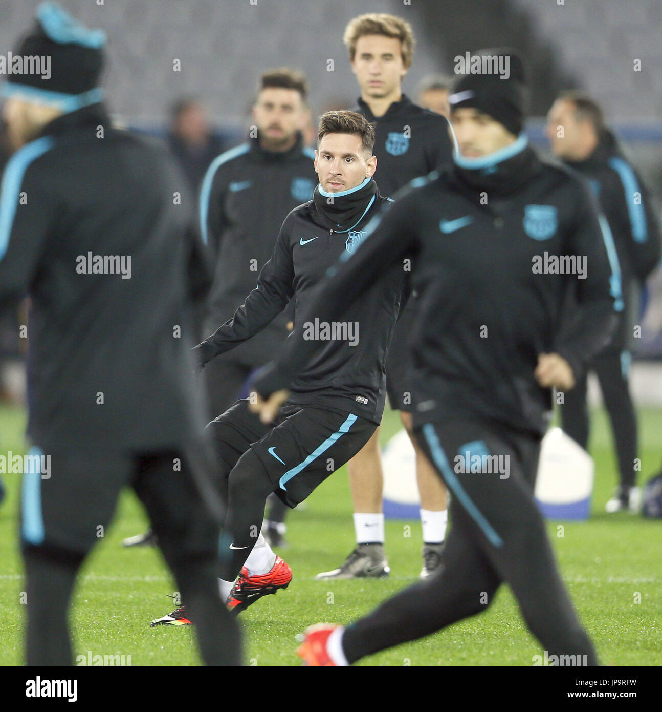 Lionel Messi (C) takes part in a training session at International ...