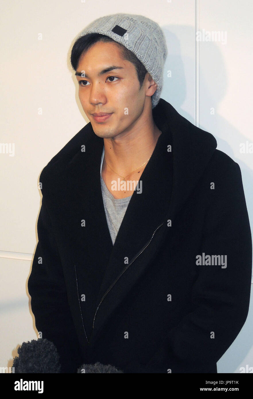 Mainz forward Yoshinori Muto speaks to reporters at Tokyo's Haneda ...