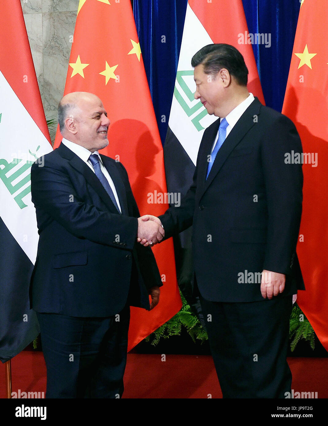 Iraqi Prime Minister Haider al-Abadi (L) and Chinese President Xi ...