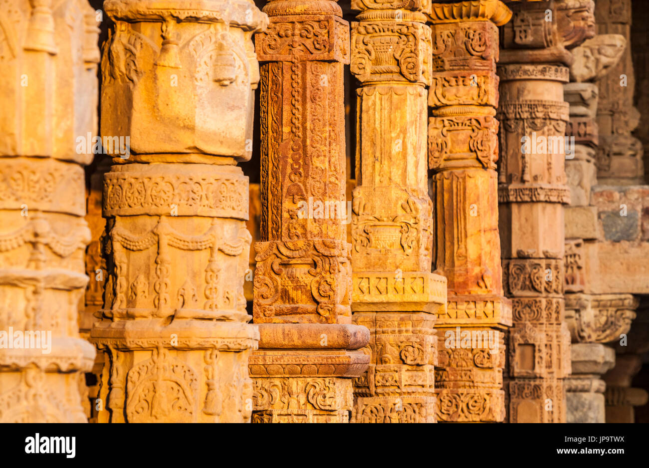 A line of ornate stone columns in the Qutb Complex, Delhi, India Stock ...