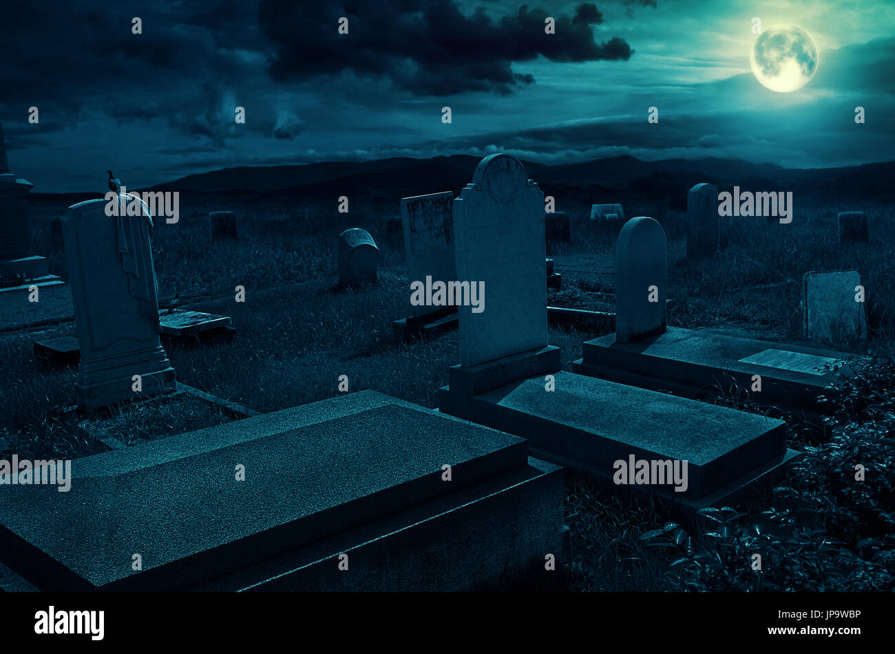 Creepy atmosphere in the cemetery with tombstone Stock Photo - Alamy