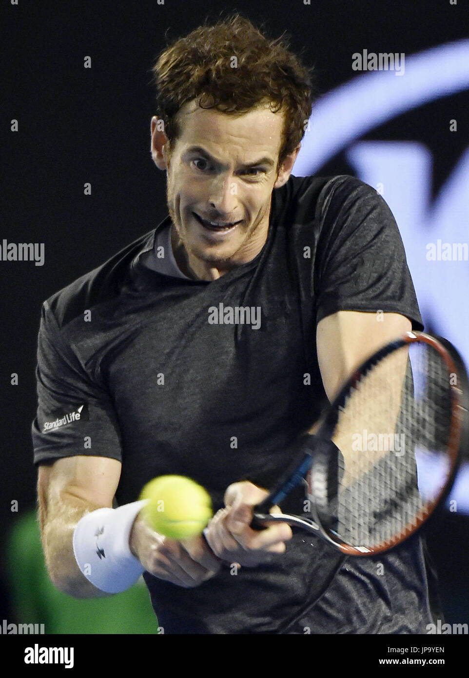 Andy Murray of Britain hits a backhand en route to a straight-sets win ...
