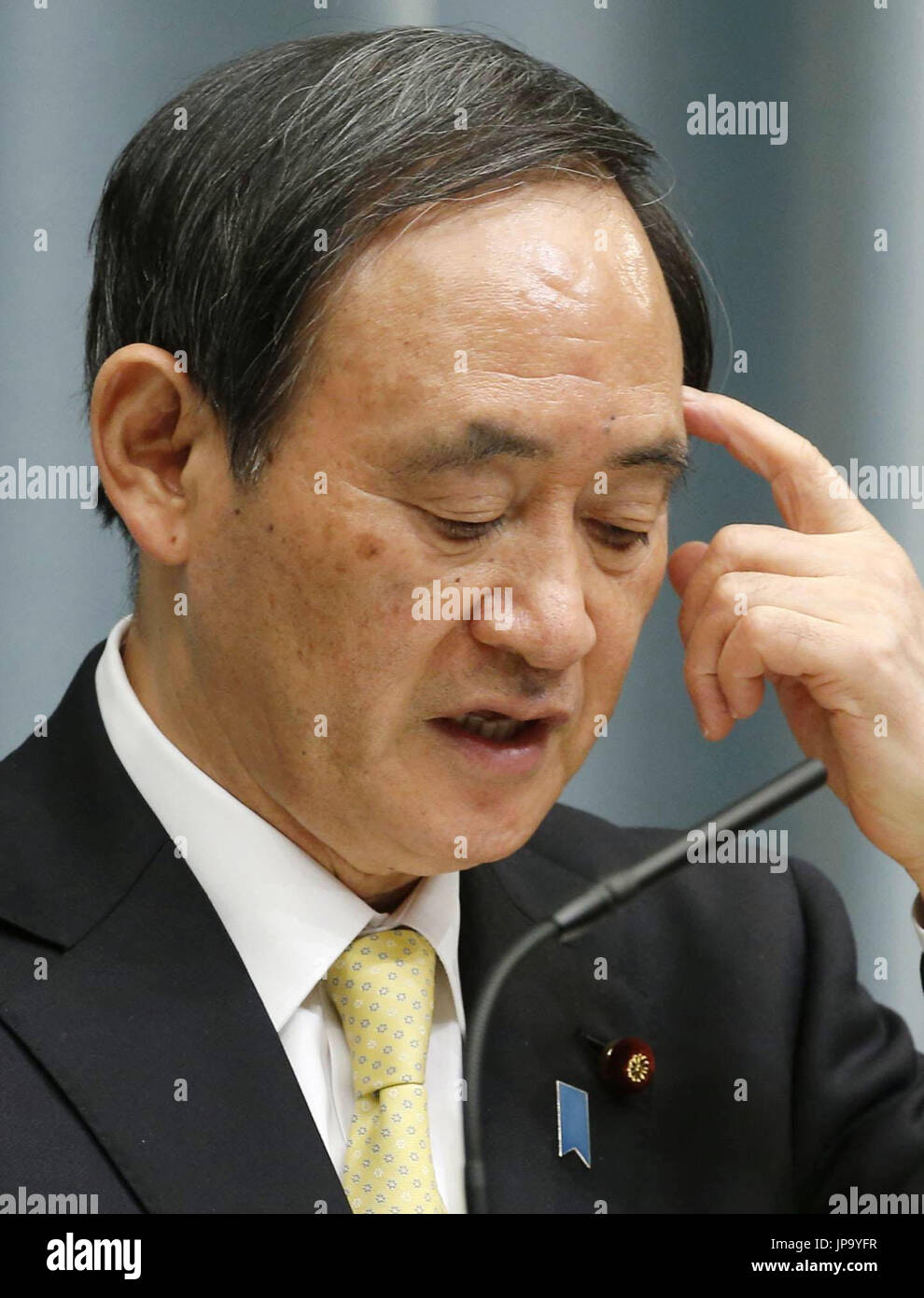 Chief Cabinet Secretary Yoshihide Suga attends a regular press ...