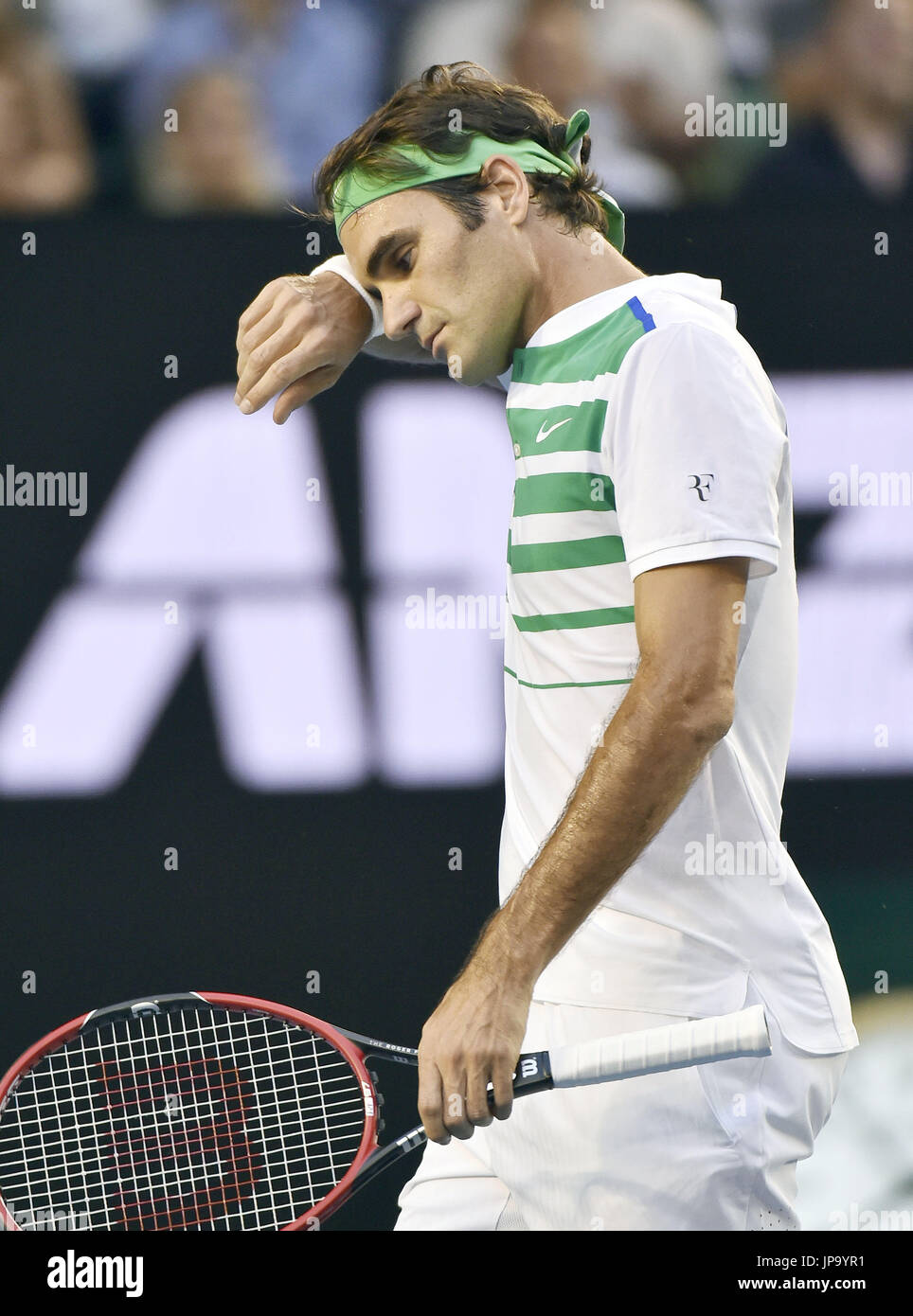Third-seeded Roger Federer of Switzerland wipes sweat during his men's ...