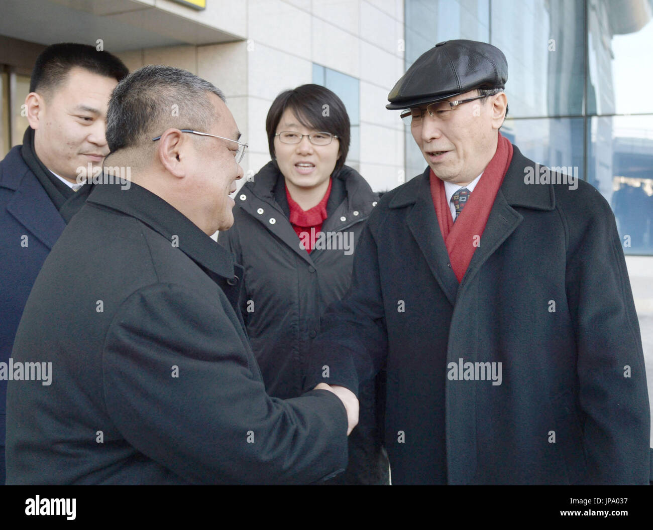 China's top nuclear envoy, Wu Dawei, (R) is welcomed after arriving at ...